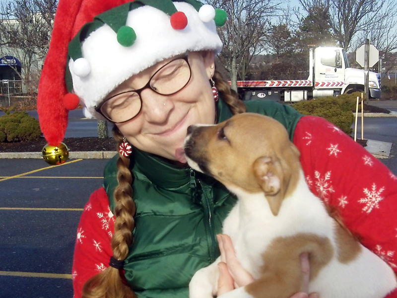 Volunteer elf Heather Straz and Rosie the puppy. (Photo courtesy Sean ...