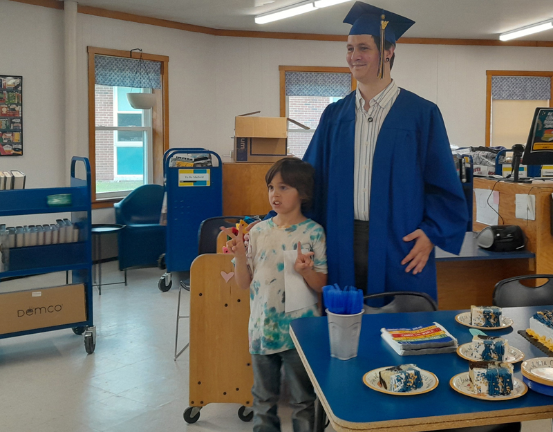 Zachary Perkins and his son Banther pose for a picture after the - The ...