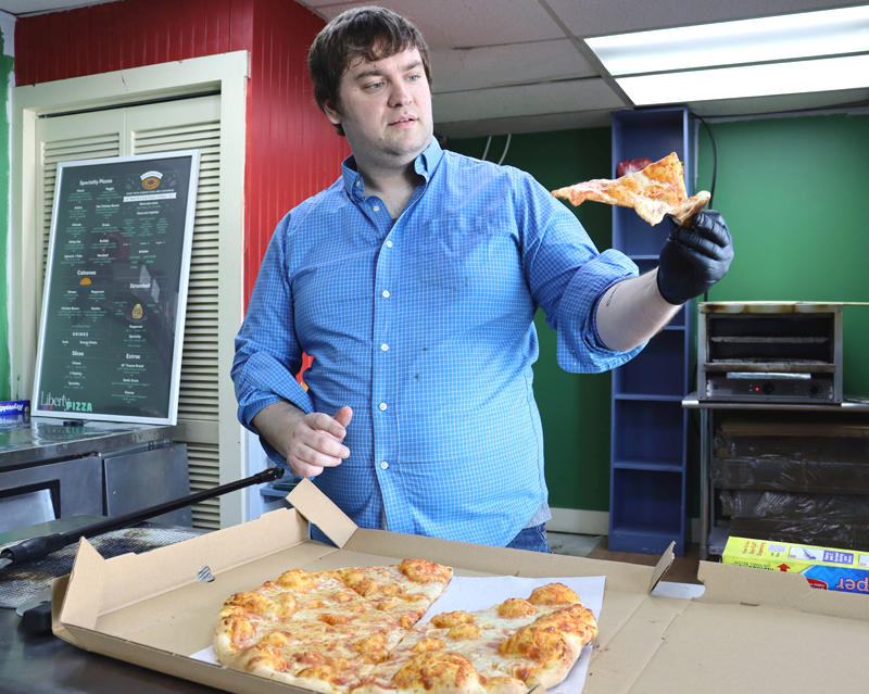 Liberty Pizza owner Richard Petron analyzes a pizza fresh from t - The ...
